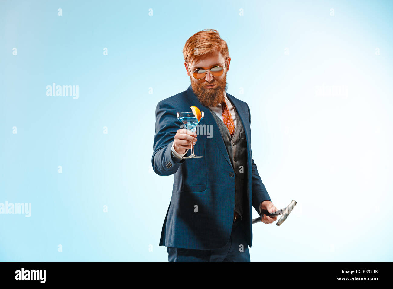 The barded man in a suit holding cane Stock Photo - Alamy