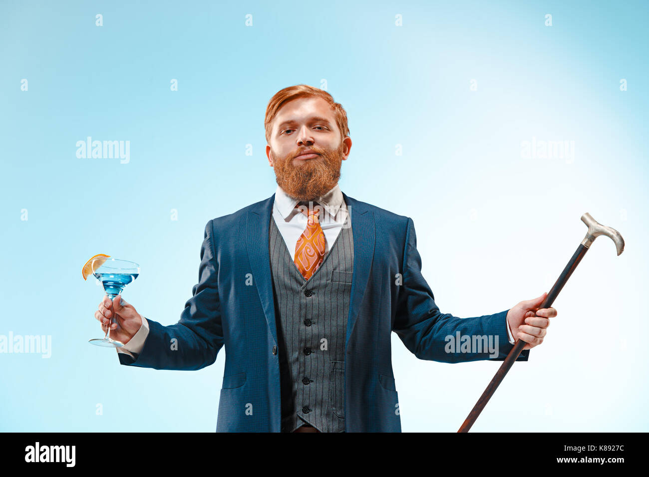 The barded man in a suit holding cane Stock Photo - Alamy