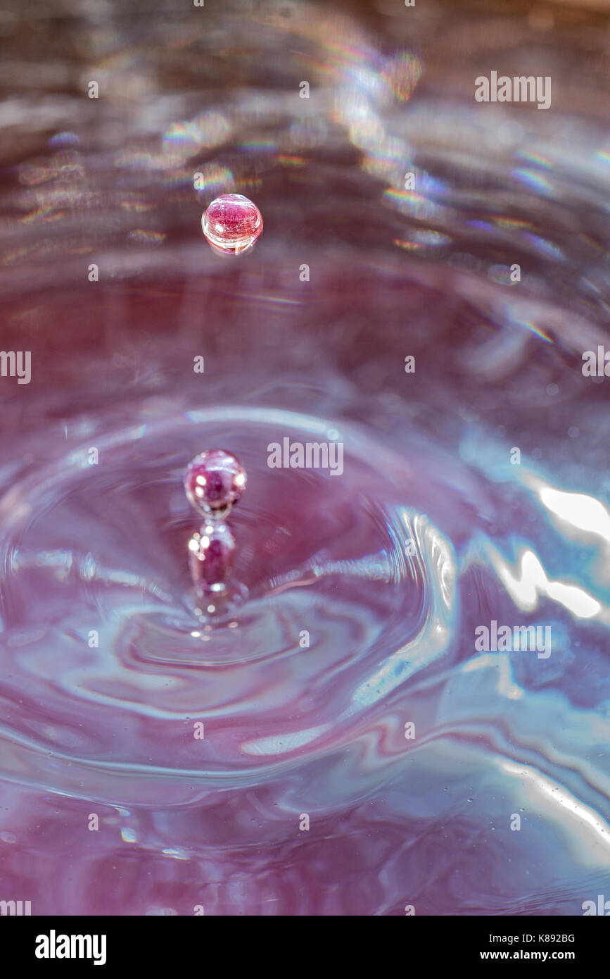 Pink color liquid droplet hi-res stock photography and images - Alamy