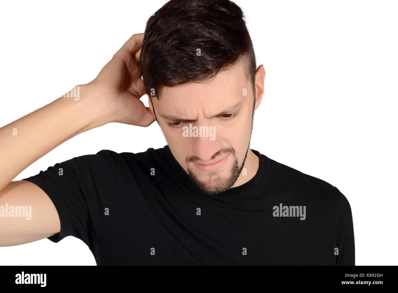 Portrait of a young man worried. Isolated white background Stock Photo ...