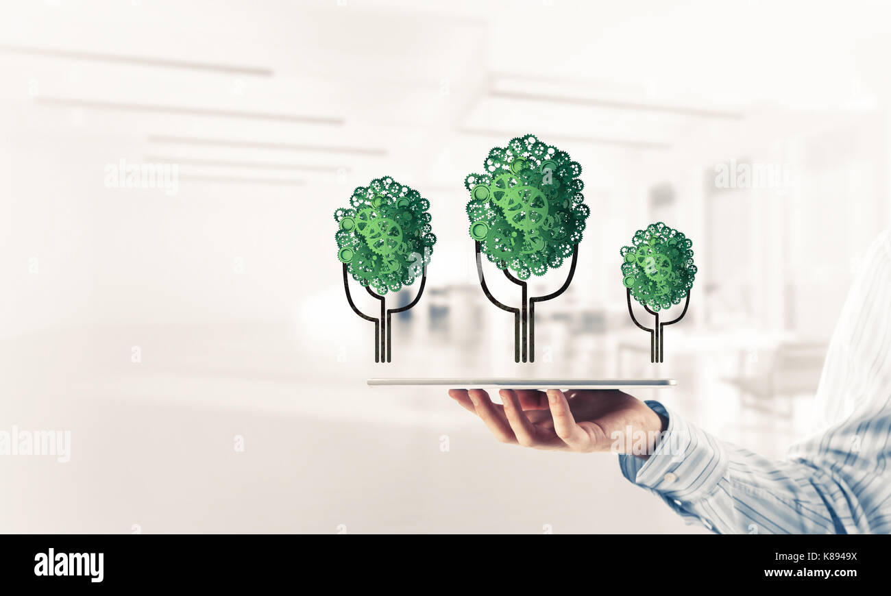 Eco green environment concept presented by tree as working mecha Stock ...