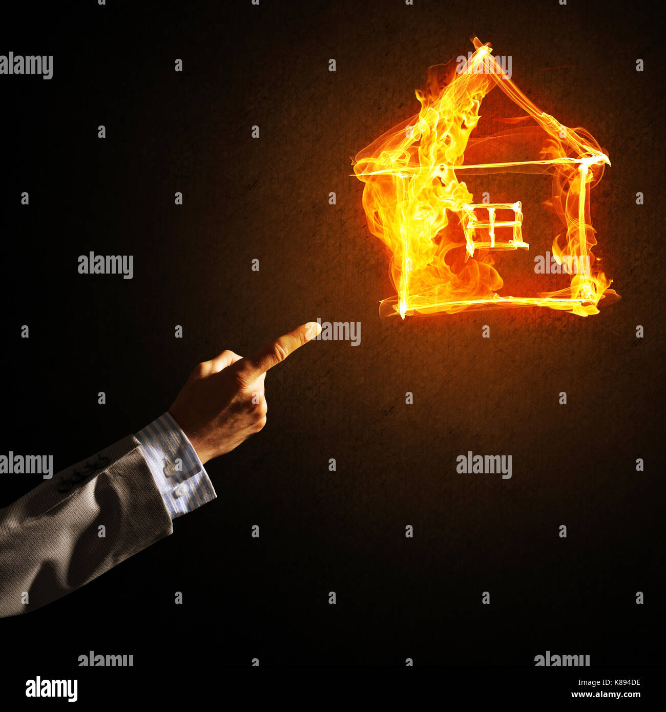 Businessman hand pointing at burning fire symbol Stock Photo - Alamy