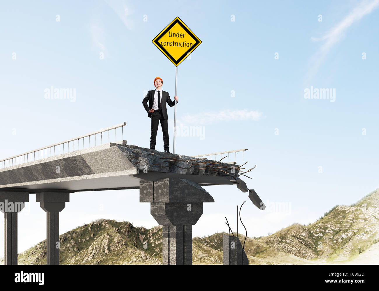 Confident engineer holding street safety sign Stock Photo - Alamy