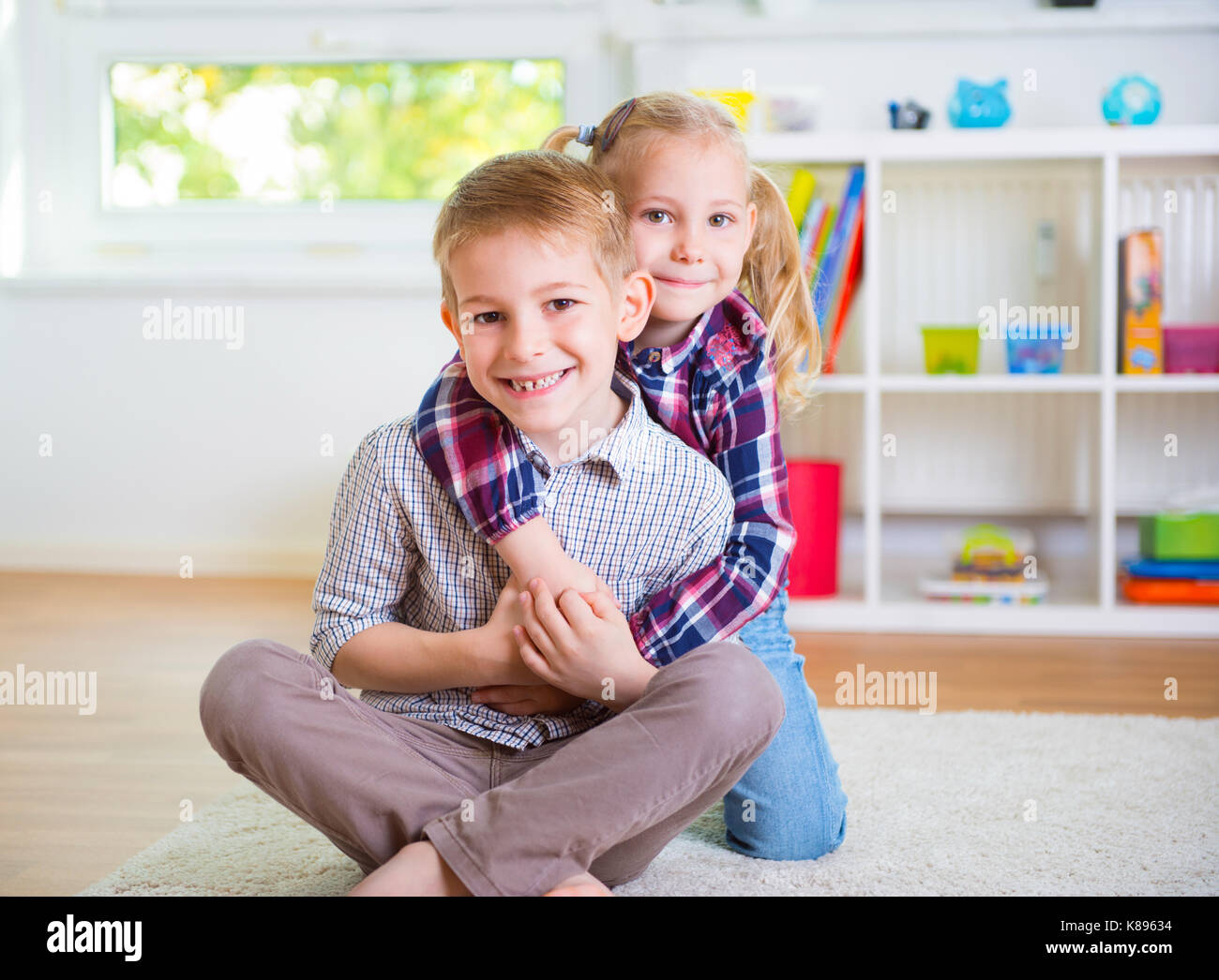 Cute little brother and sister having fun at home Stock Photo - Alamy