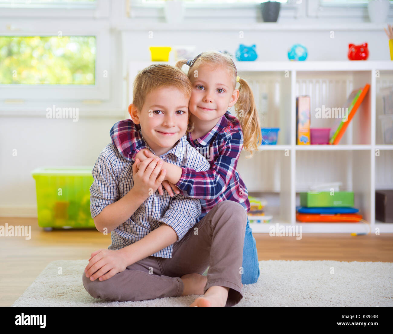 Cute little brother and sister having fun at home Stock Photo - Alamy