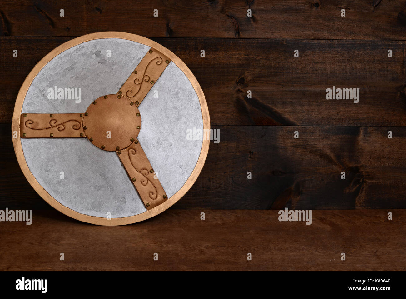 warrior shield leaning on wood wall Stock Photo - Alamy