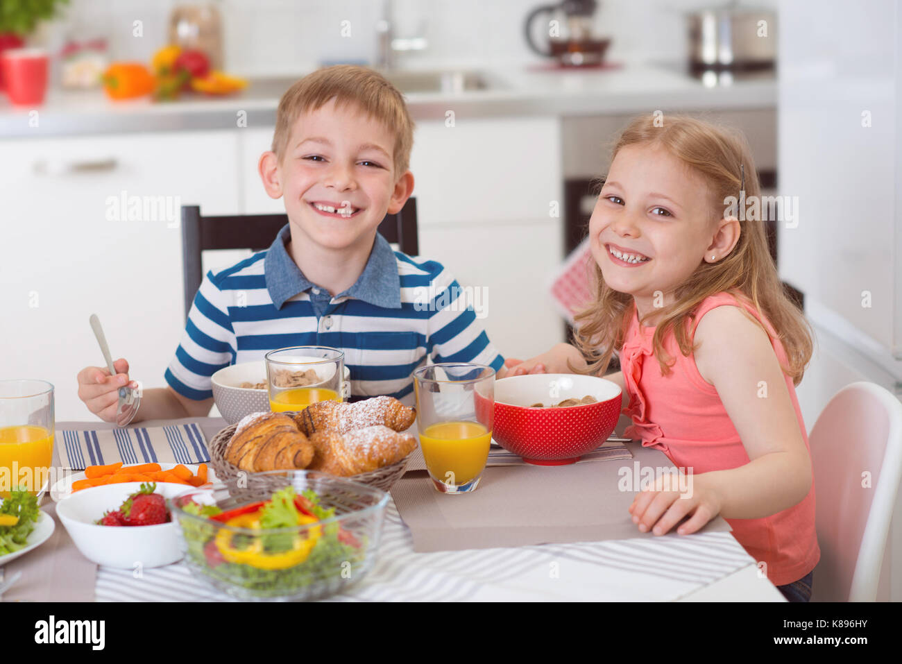 Two children having healthy snack hi-res stock photography and images ...