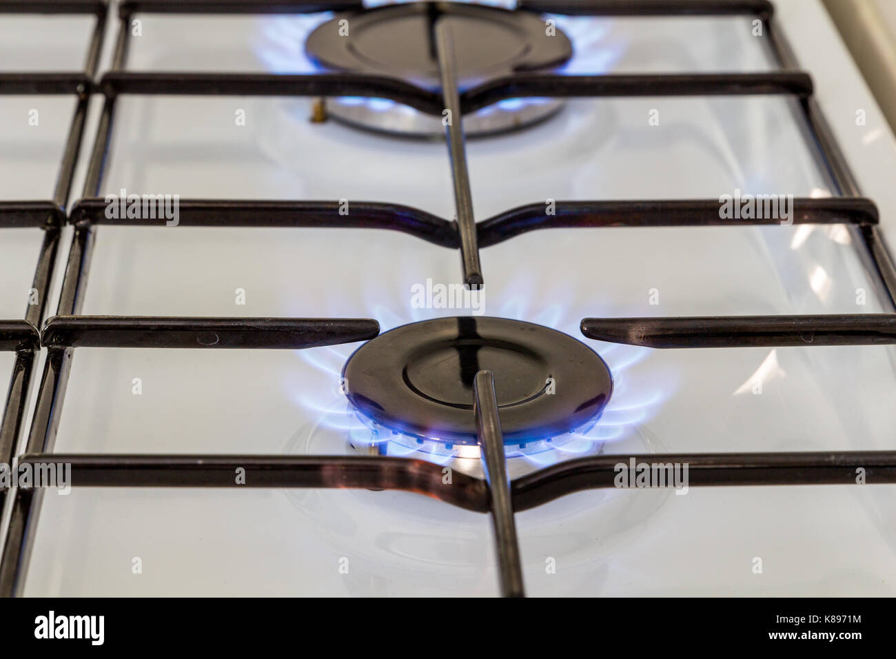 Burning on a gas stove in the kitchen Stock Photo - Alamy