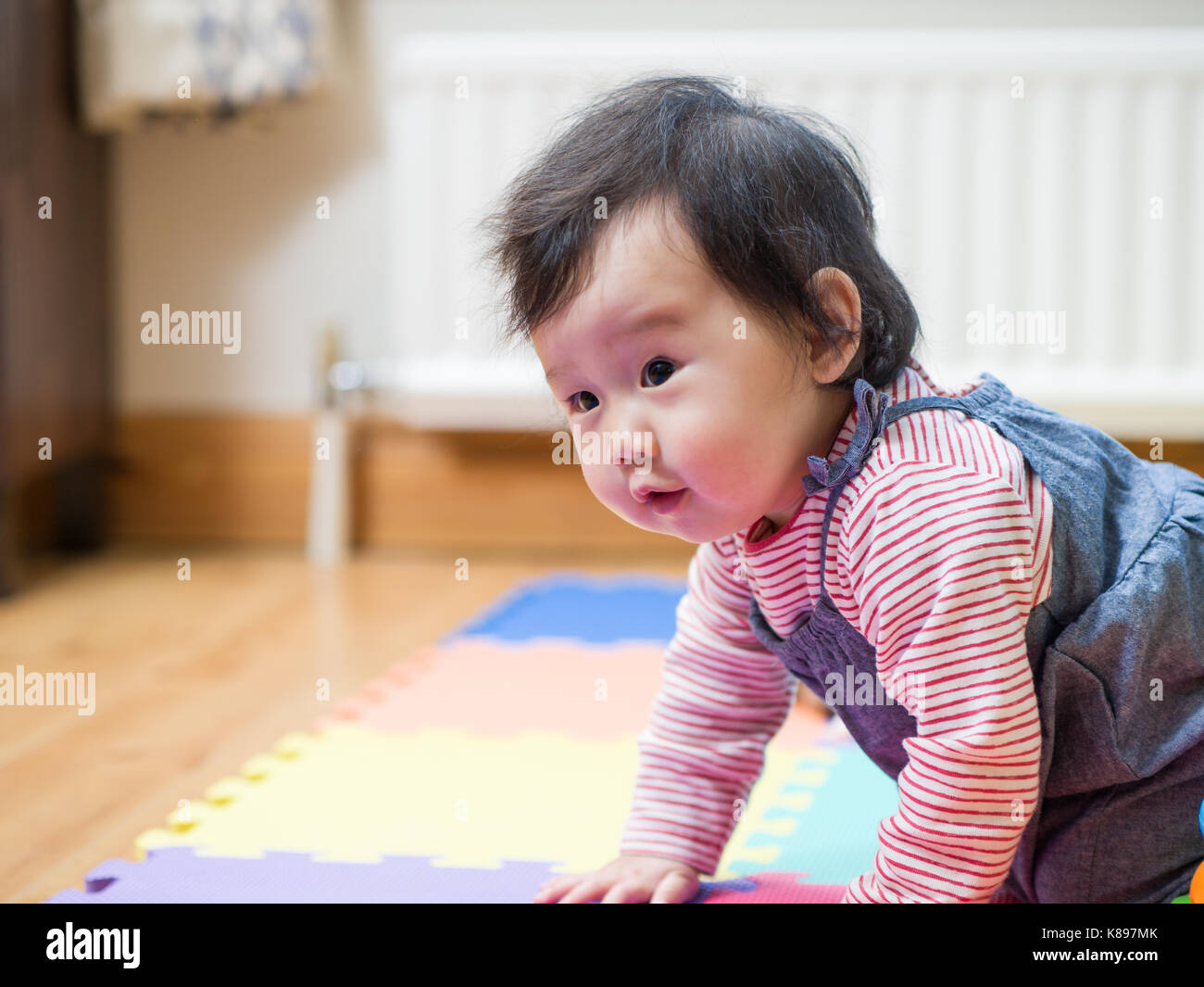 Chinese baby crawling at home hi-res stock photography and images - Alamy