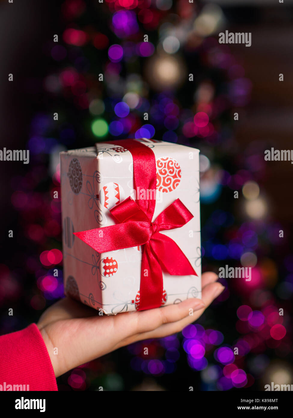 Woman packing surprise gift hi-res stock photography and images - Alamy