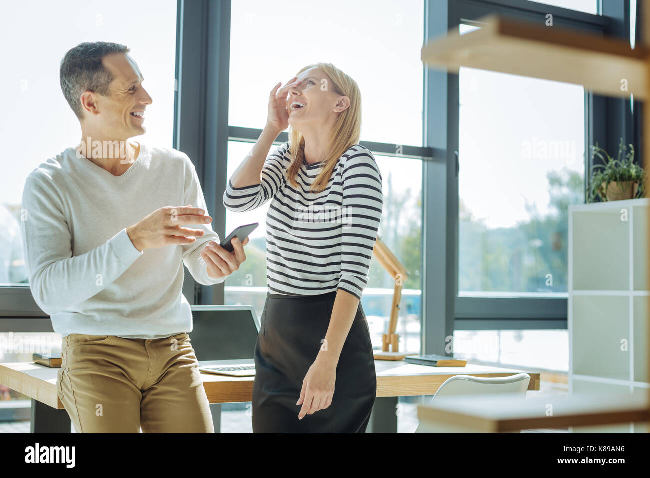Happy cheerful woman laughing Stock Photo - Alamy