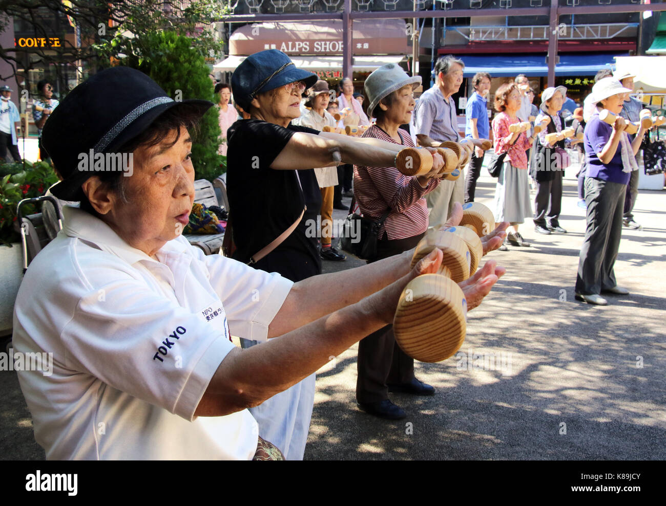 Tokyo, Japan. 18th Sep, 2017. Elderly people work out with wooden ...