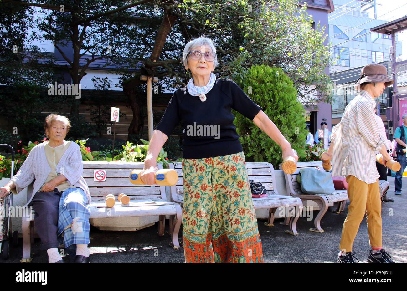 Tokyo, Japan. 18th Sep, 2017. Elderly people work out with wooden ...