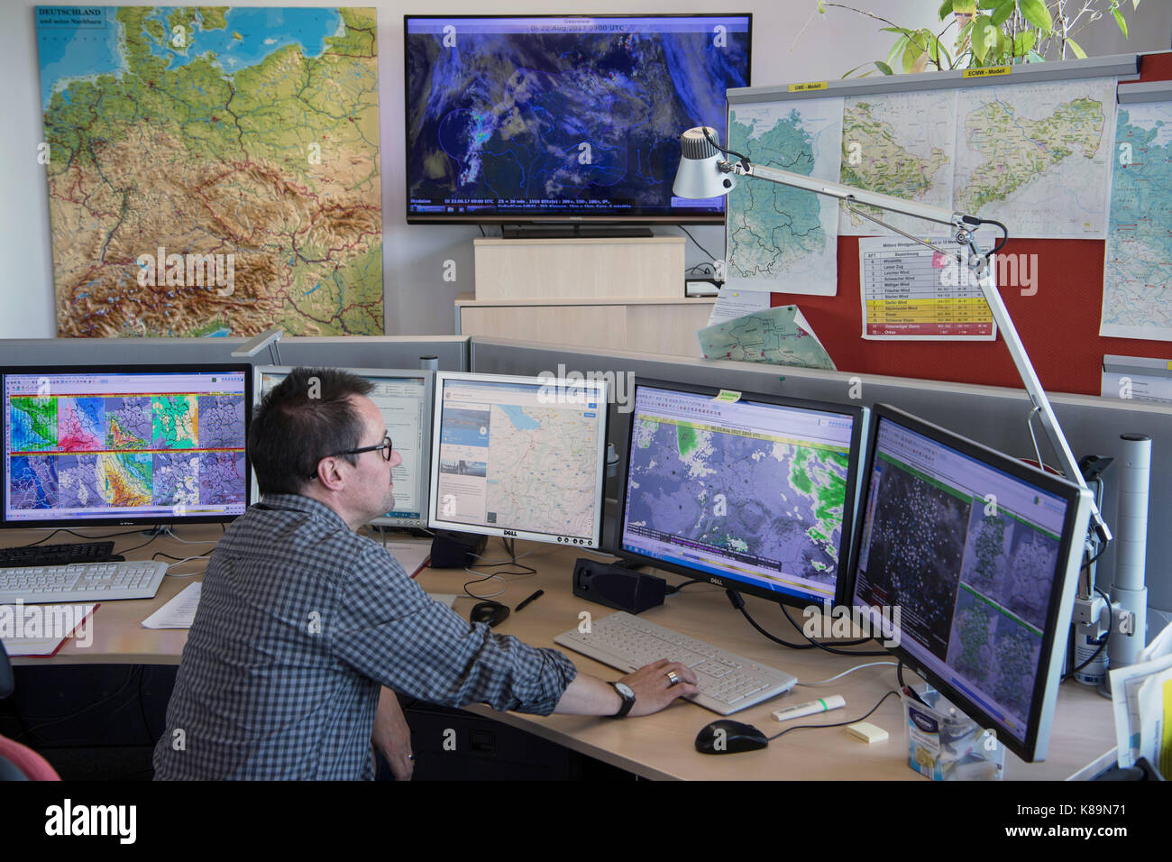 Offenbach am Main, Germany. 22nd Aug, 2017. Employees track weather ...