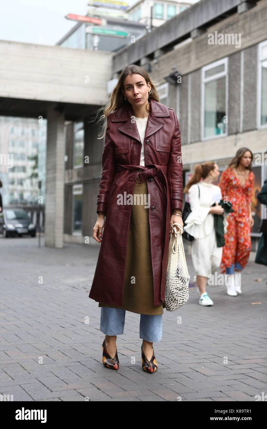Blogger Irina Lakicevic posing outside of the Roland Mouret runway show ...