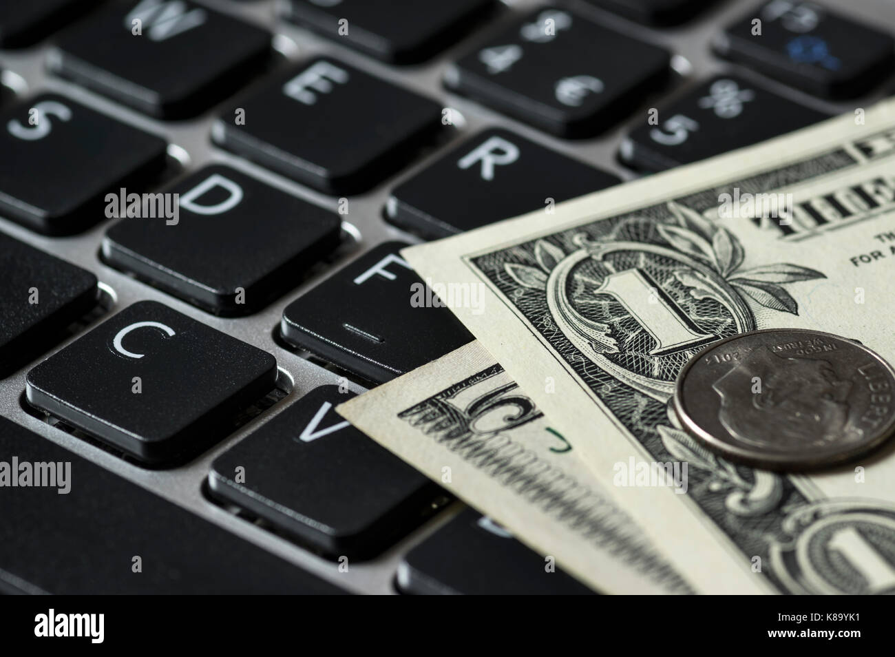 Money on keyboard computer hi-res stock photography and images - Alamy