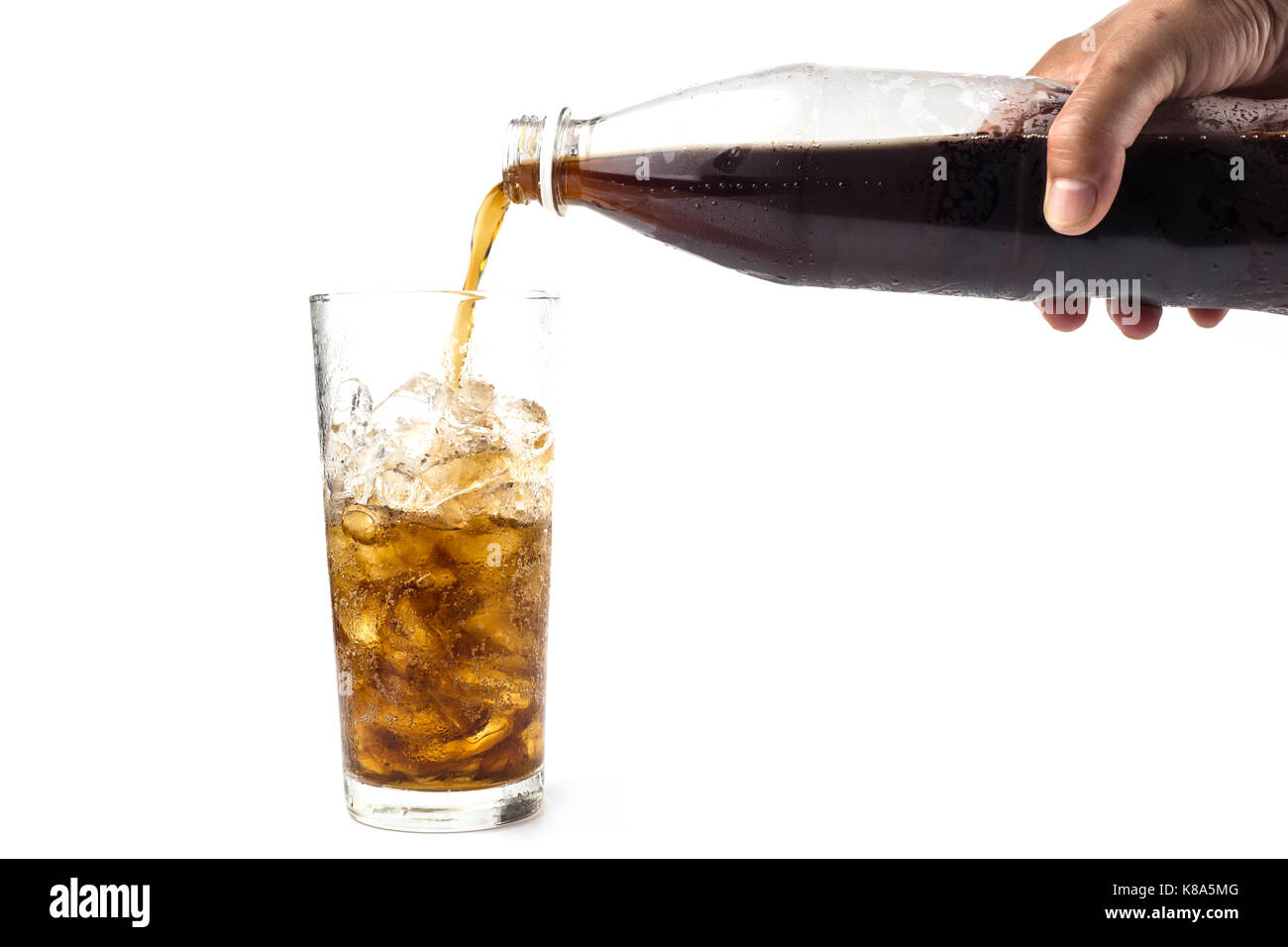 Cola in glass isolated on white background Stock Photo - Alamy