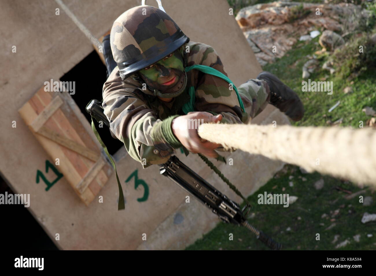 A legionnaire from the 2REP (2nd Foreign Paratroop Regiment) scales a ...