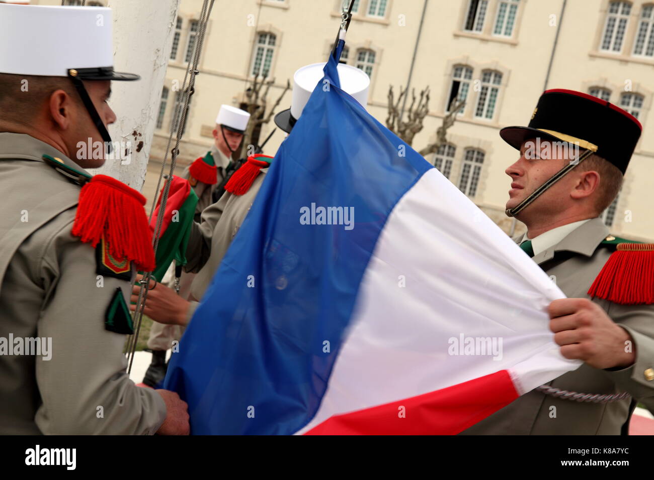 Legionnaires from the 2REI (2nd Foreign Infantry Regiment) lower the ...