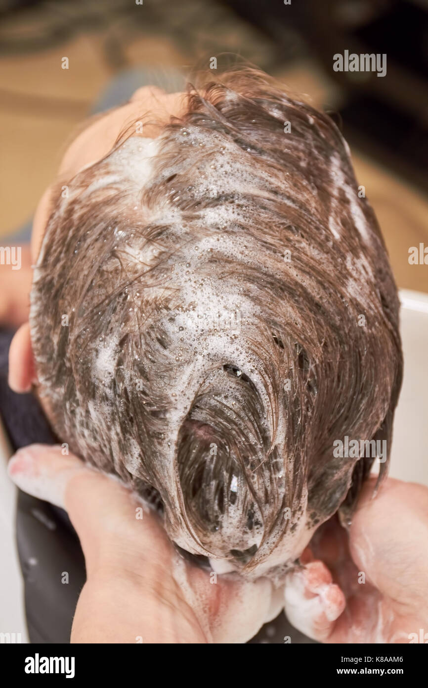 Hands washing head close up Stock Photo - Alamy