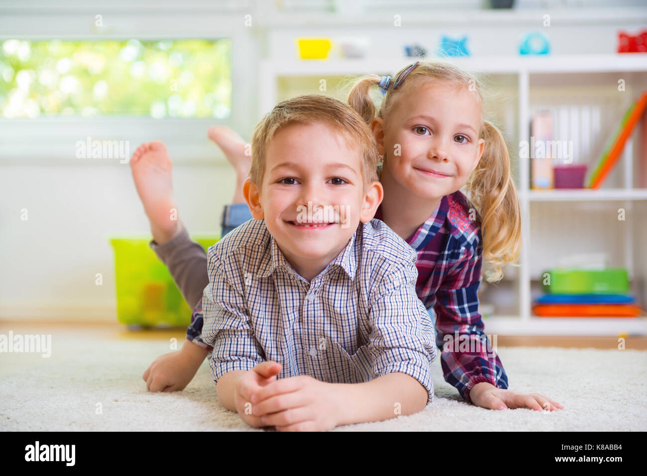 Cute little brother and sister having fun at home Stock Photo - Alamy