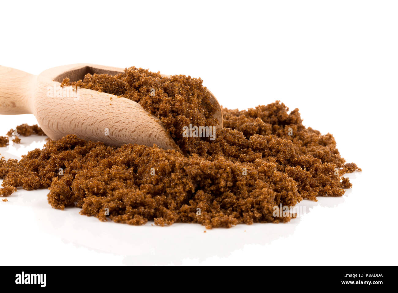 brown muscovado sugar in scoop isolated on white background Stock Photo ...