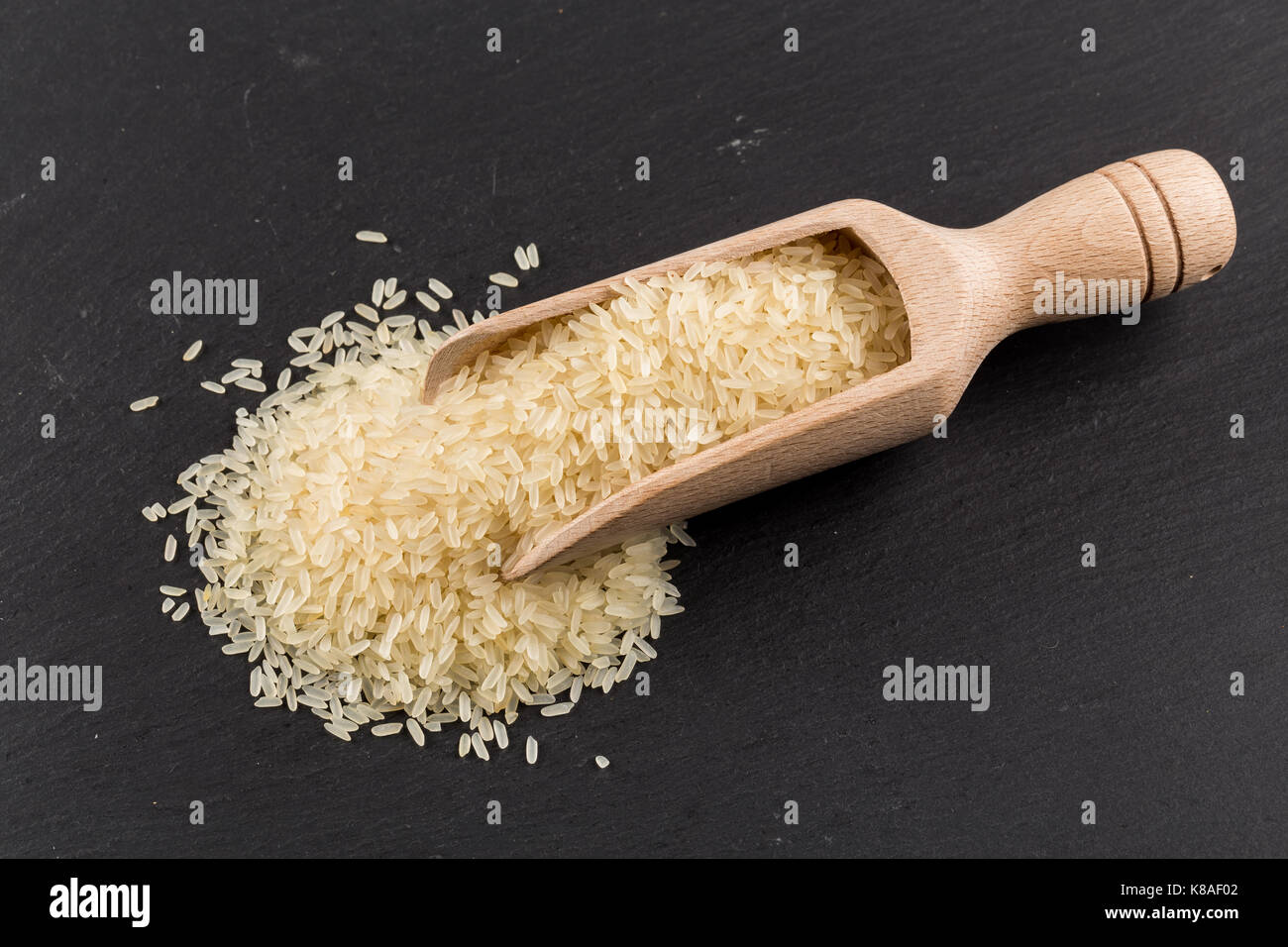 Scoop of rice on puffed rice cereal background close up Stock Photo - Alamy