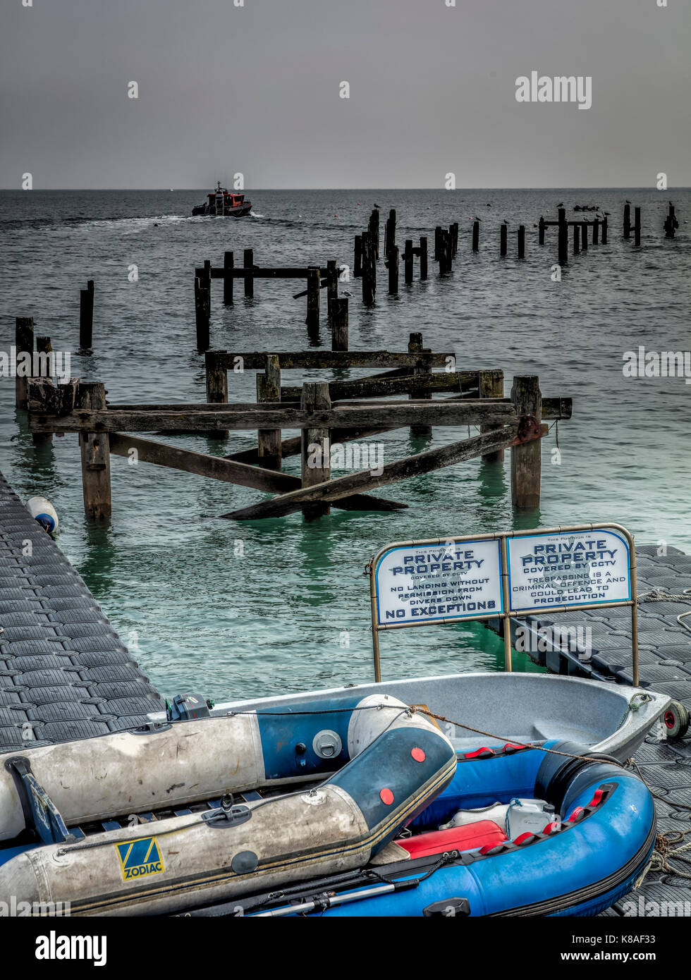 Old Swanage Pier in Dorset with fishing boat Stock Photo - Alamy