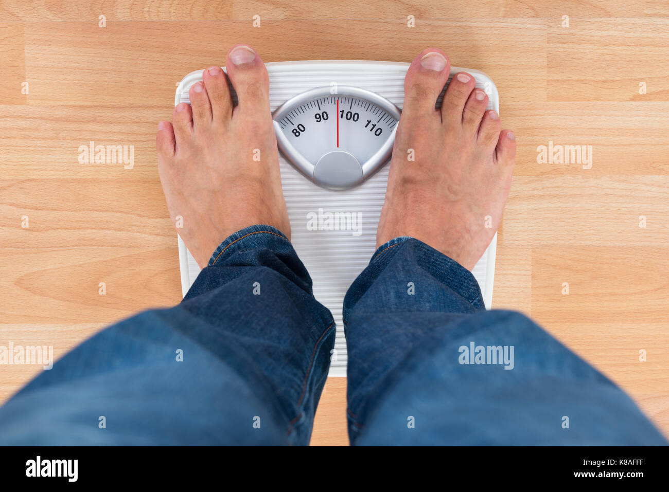 Person standing on scale jeans hi-res stock photography and images - Alamy
