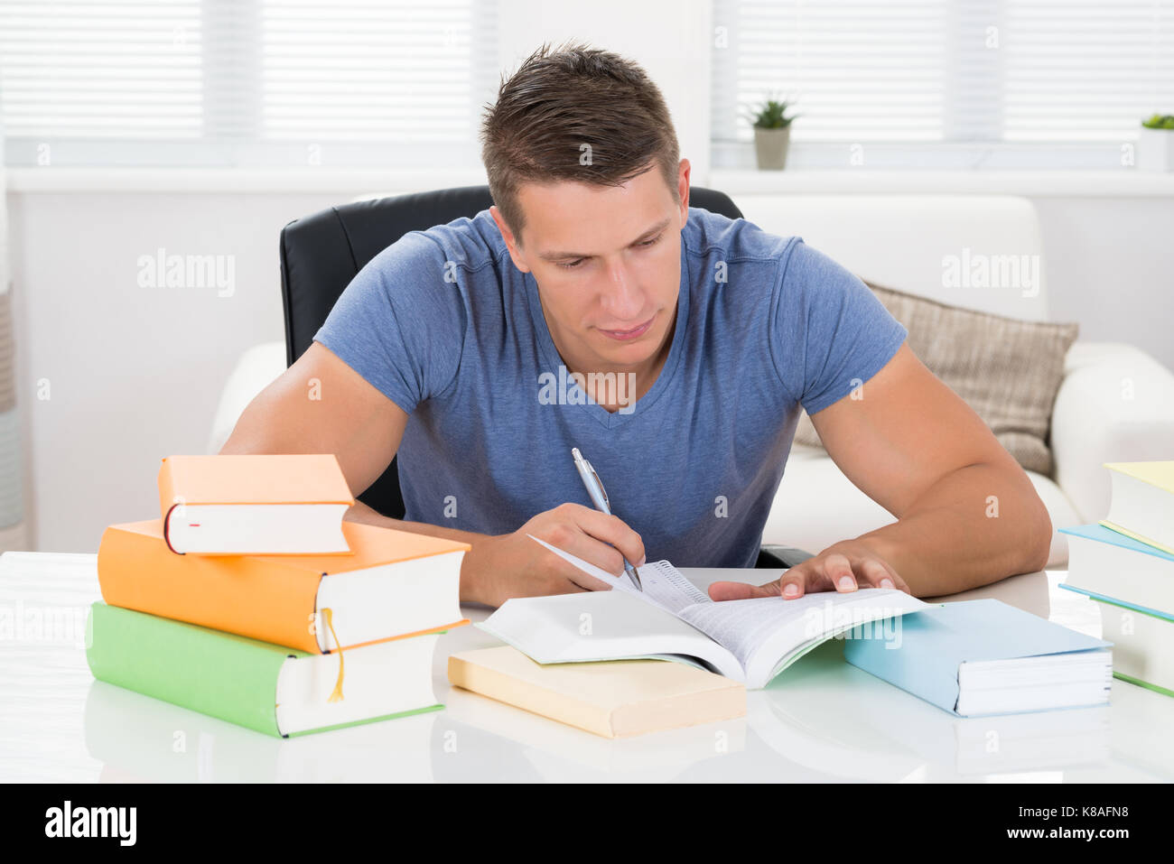 Man reading in study hi-res stock photography and images - Alamy
