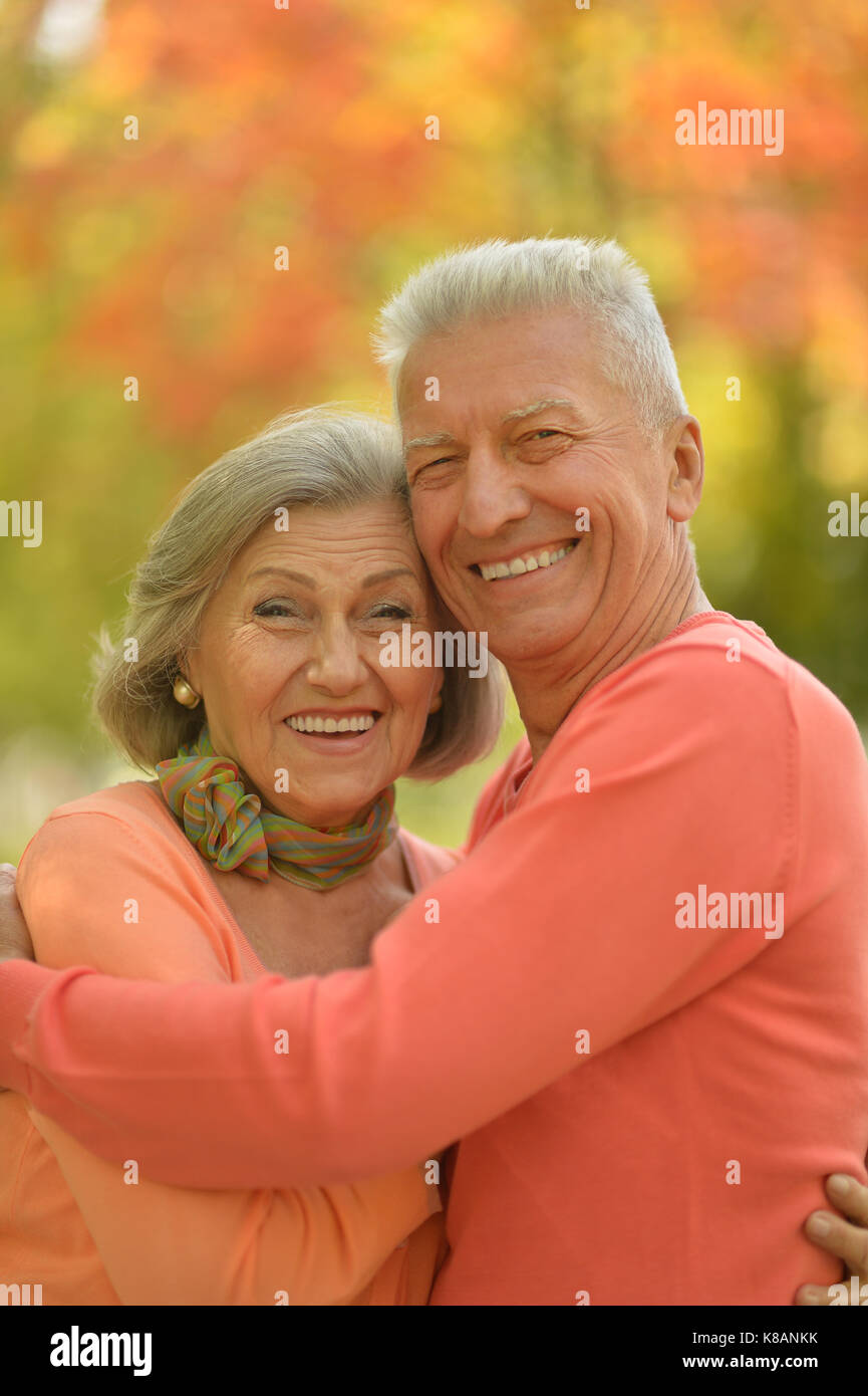 senior couple hugging in the park Stock Photo - Alamy
