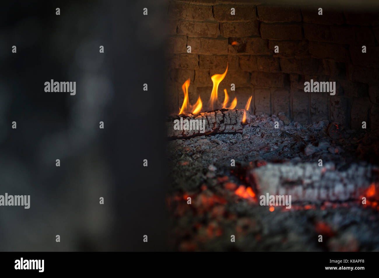 Fire wood burning in the oven Stock Photo - Alamy
