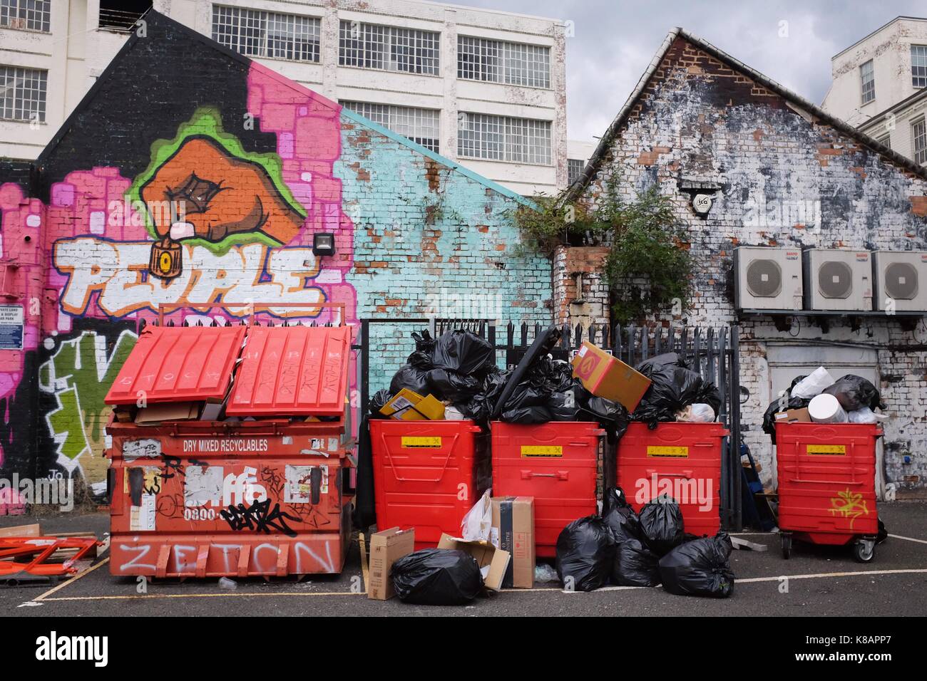 Overflowing recycling waste bins hi-res stock photography and images ...
