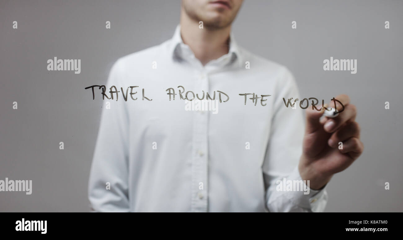 Travel around the world , Man Writing on Glass Stock Photo - Alamy