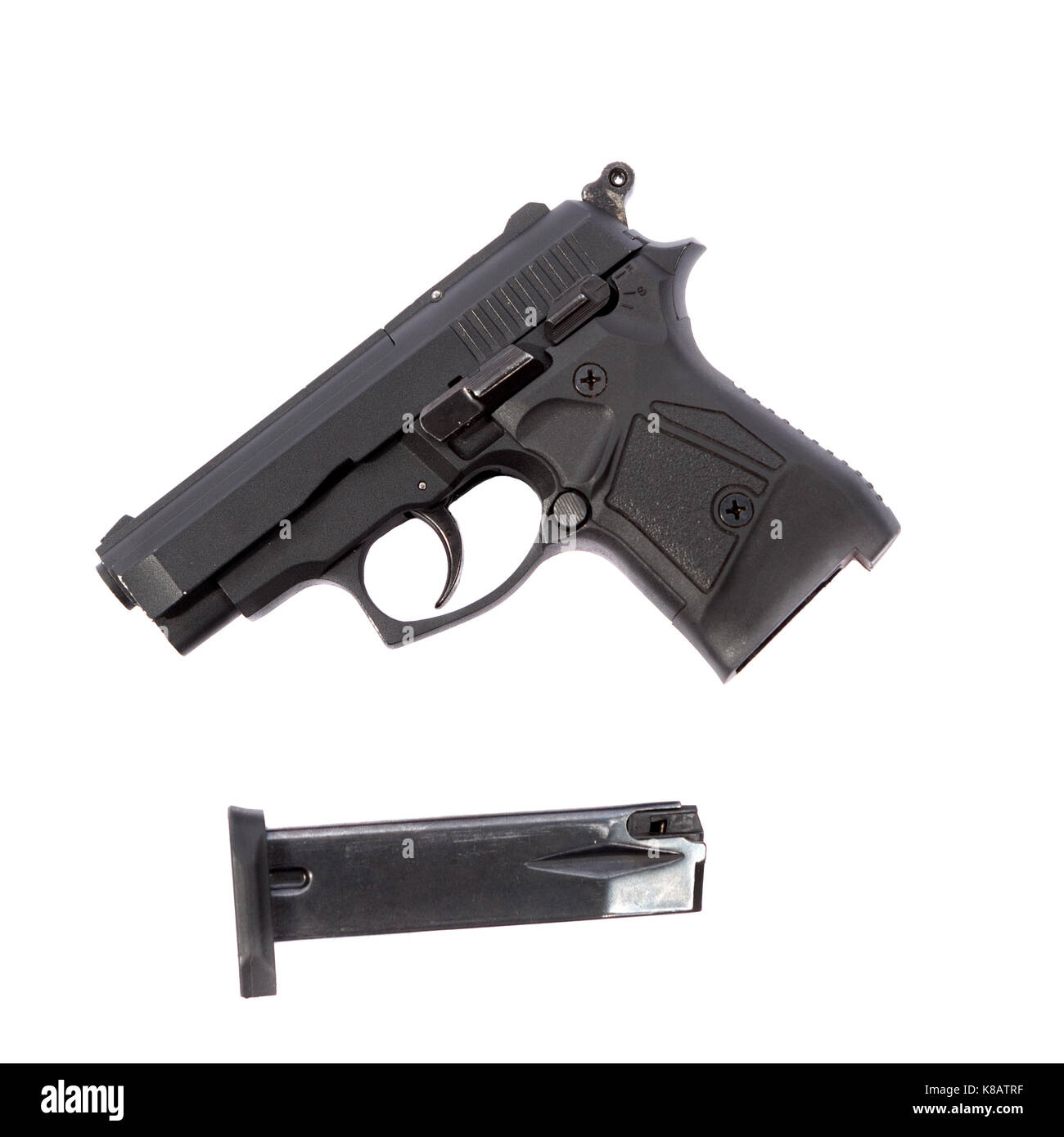 A black pistol with its magazine out Stock Photo - Alamy
