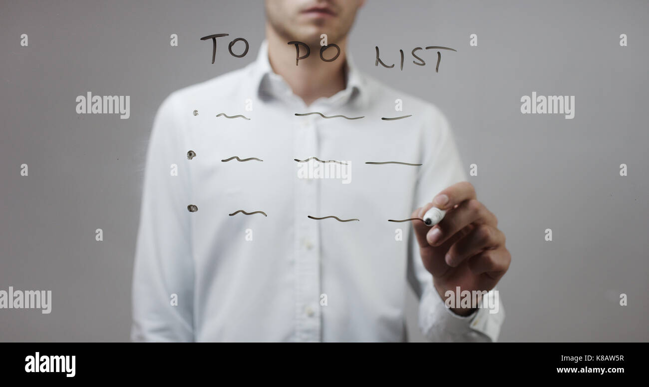 To do list , Man Writing on Glass Stock Photo - Alamy