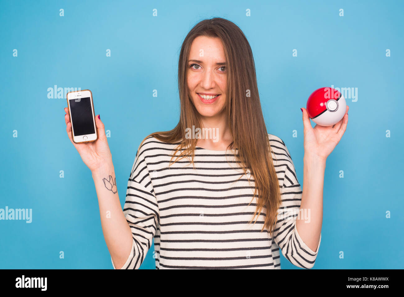 Ufa, Russia - July 8, 2017: woman holding pokeball with pikachu ...