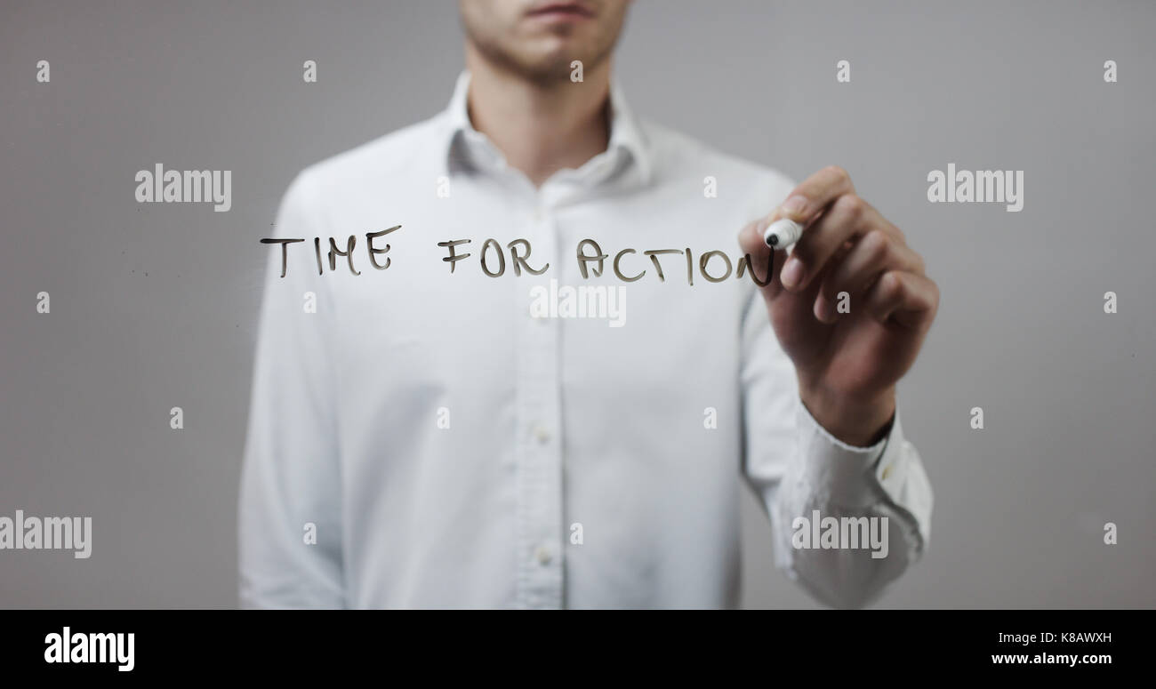 Time for action , Man Writing on Glass Stock Photo - Alamy