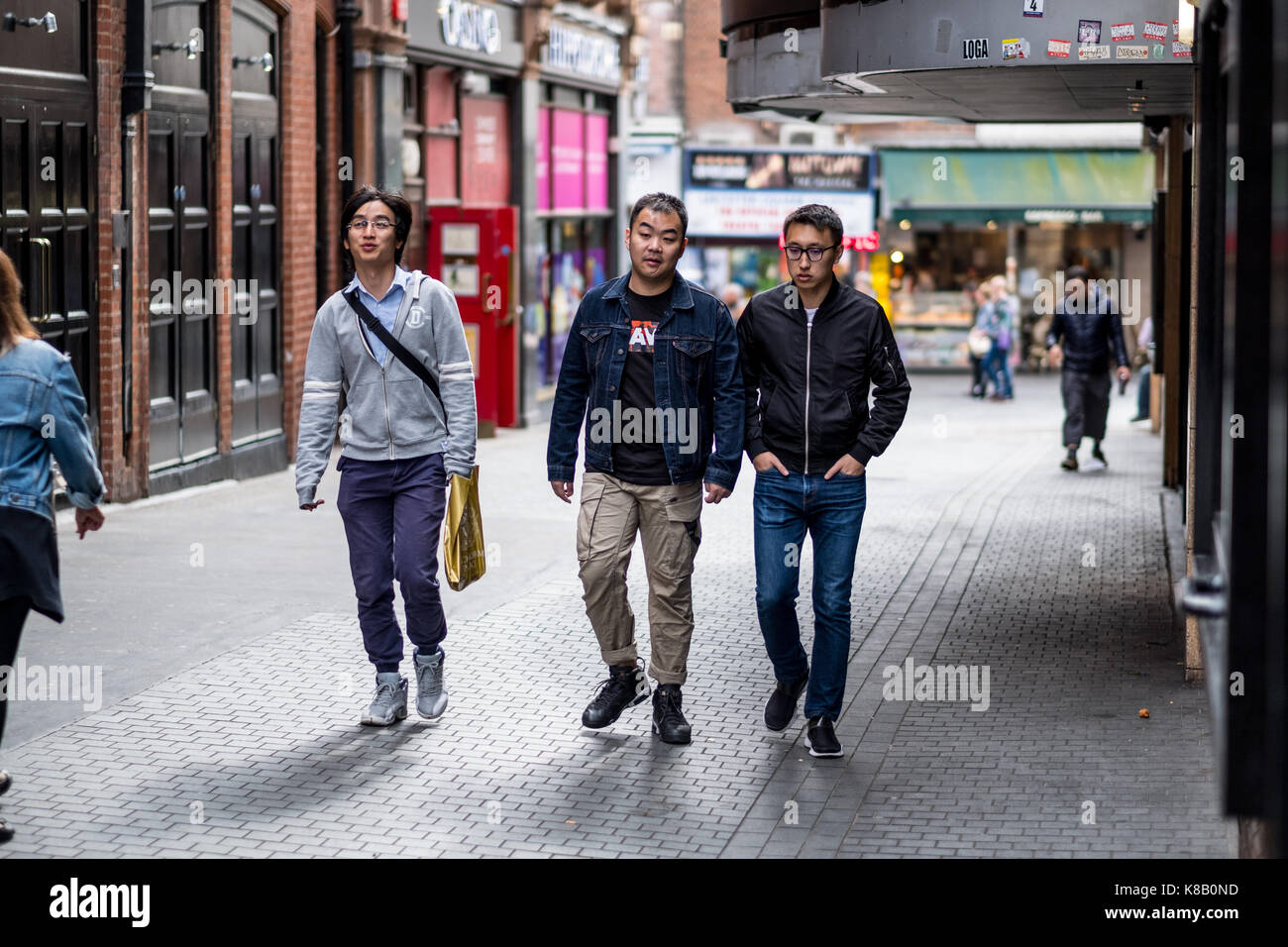 Young asian males in China Town, London, UK Stock Photo - Alamy
