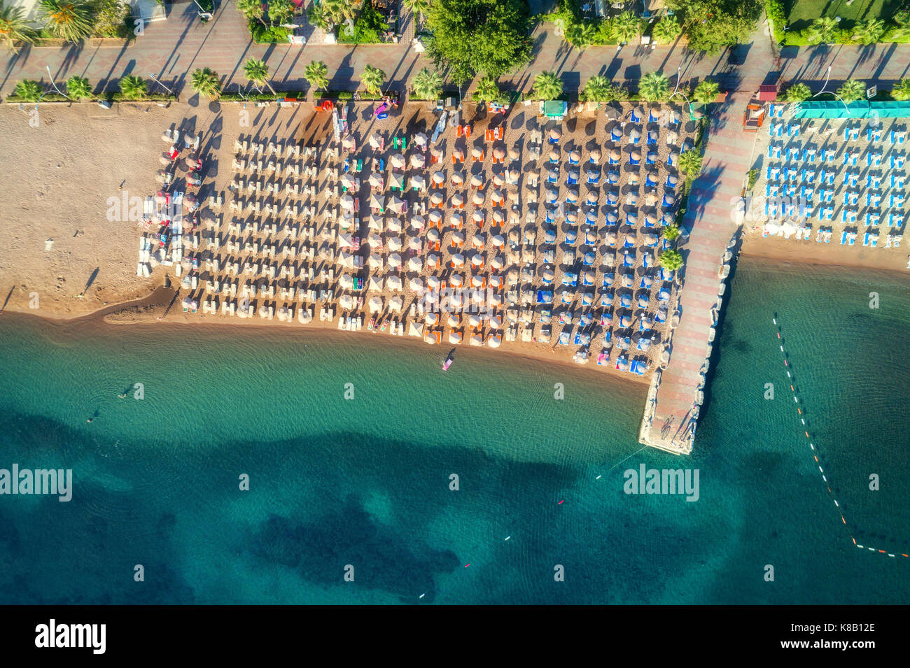 Aerial view of transparent turquoise sea, beautiful sandy beach with ...