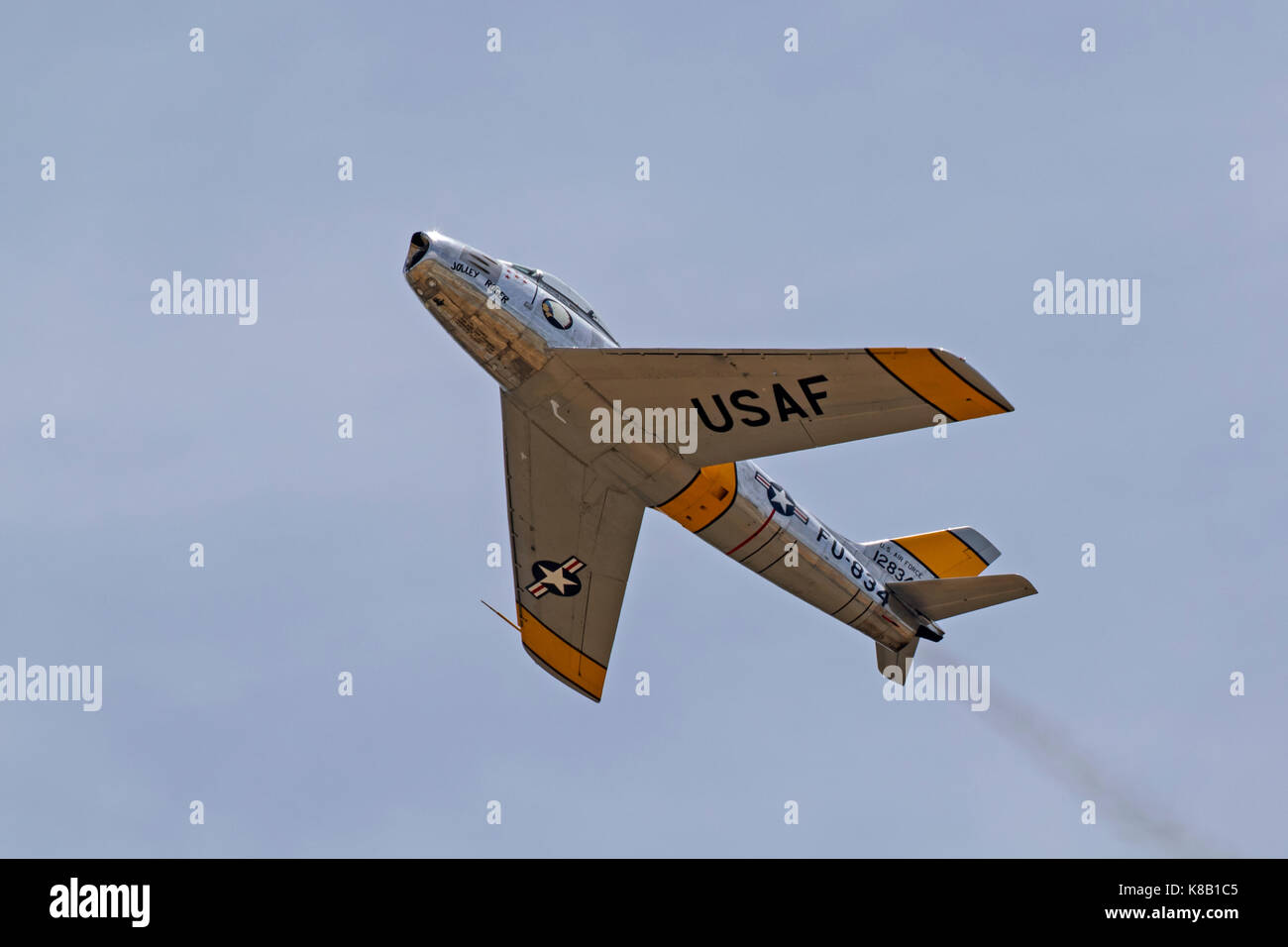 Airplane F-86 Sabre jet flying at the air show Stock Photo - Alamy