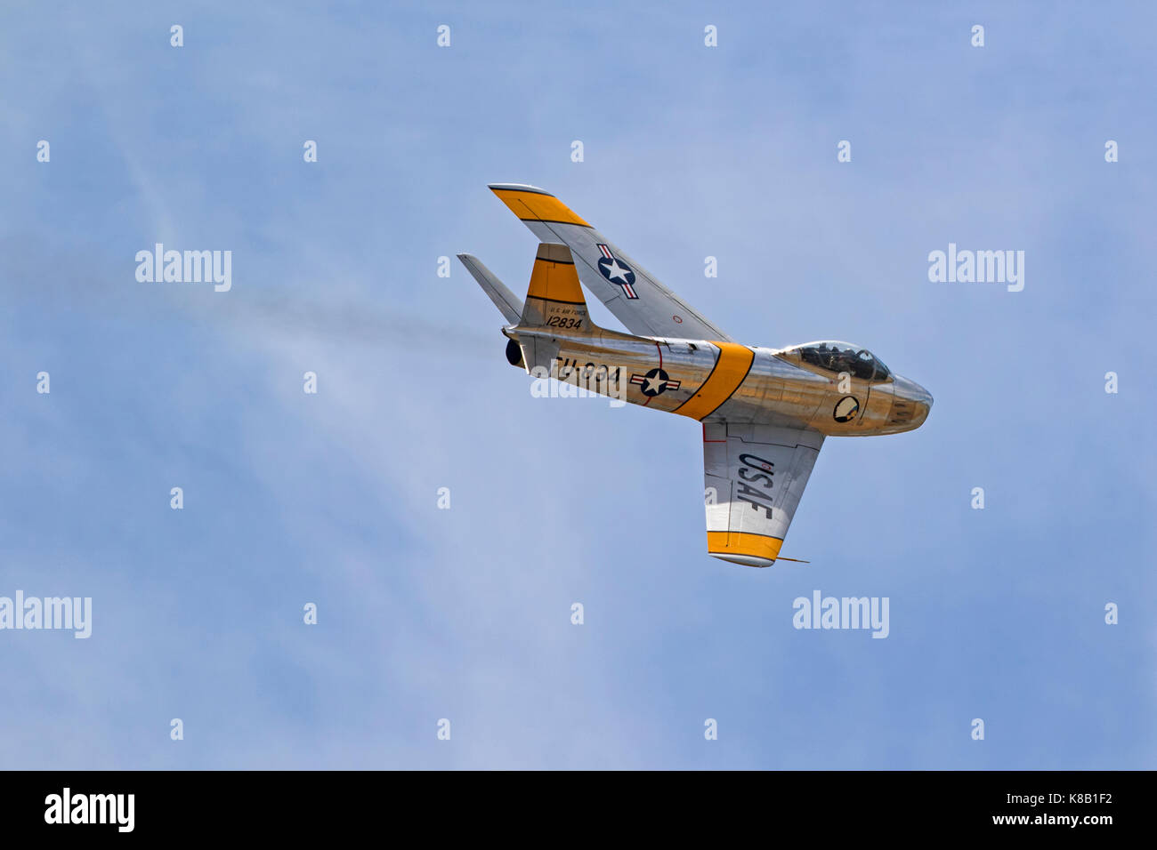 Airplane F-86 Sabre jet flying at the air show Stock Photo - Alamy