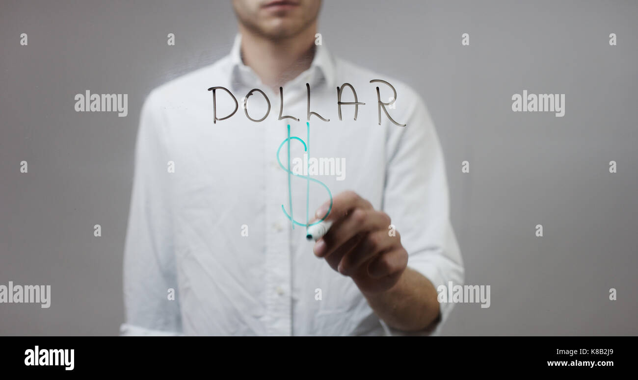 Dollar , Man Writing on Glass Stock Photo - Alamy