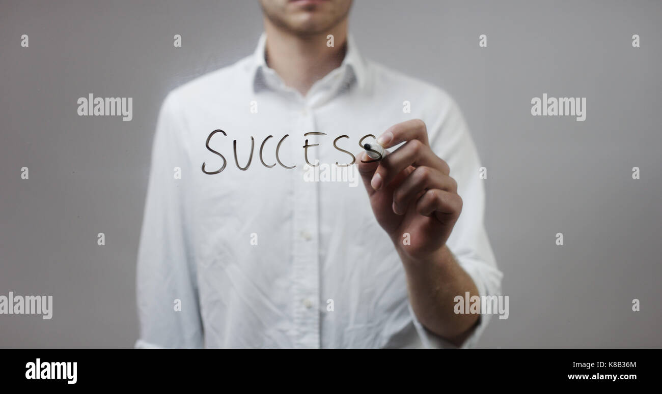 Success , Man Writing on Glass Stock Photo - Alamy