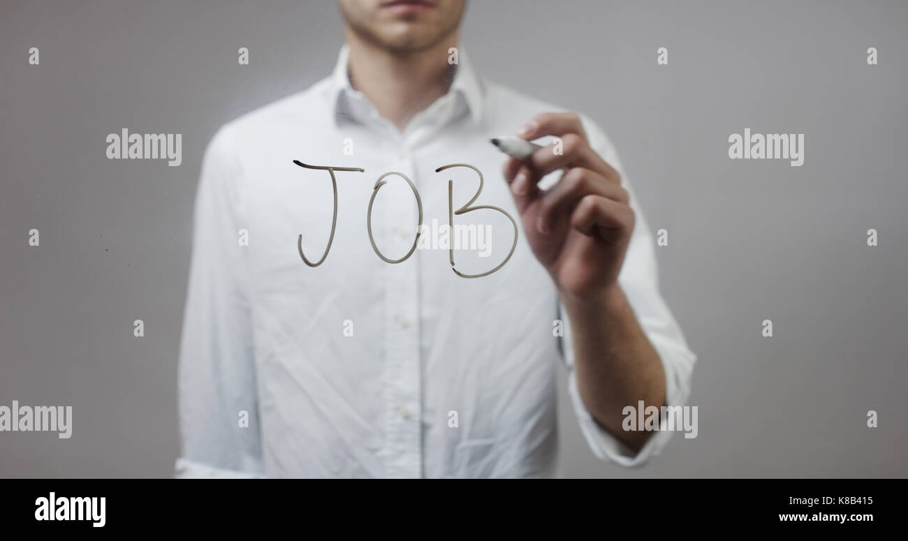 Job , Man Writing on Glass Stock Photo - Alamy