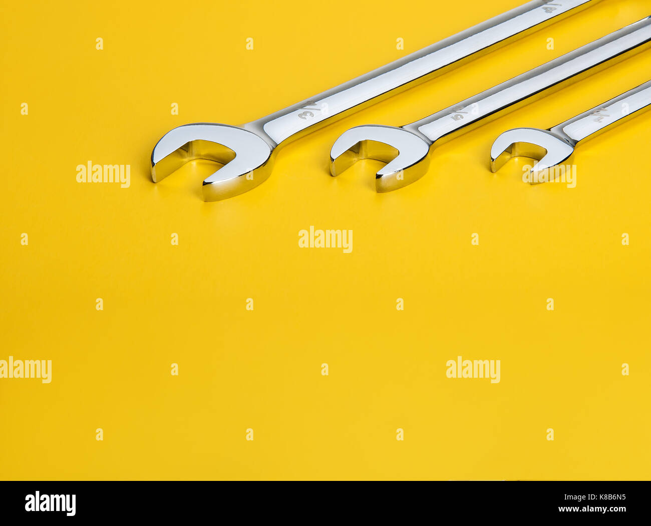 wrench set Isolated on yellow studio background Stock Photo - Alamy