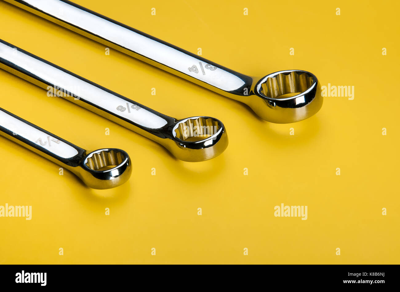wrench set Isolated on yellow studio background Stock Photo - Alamy