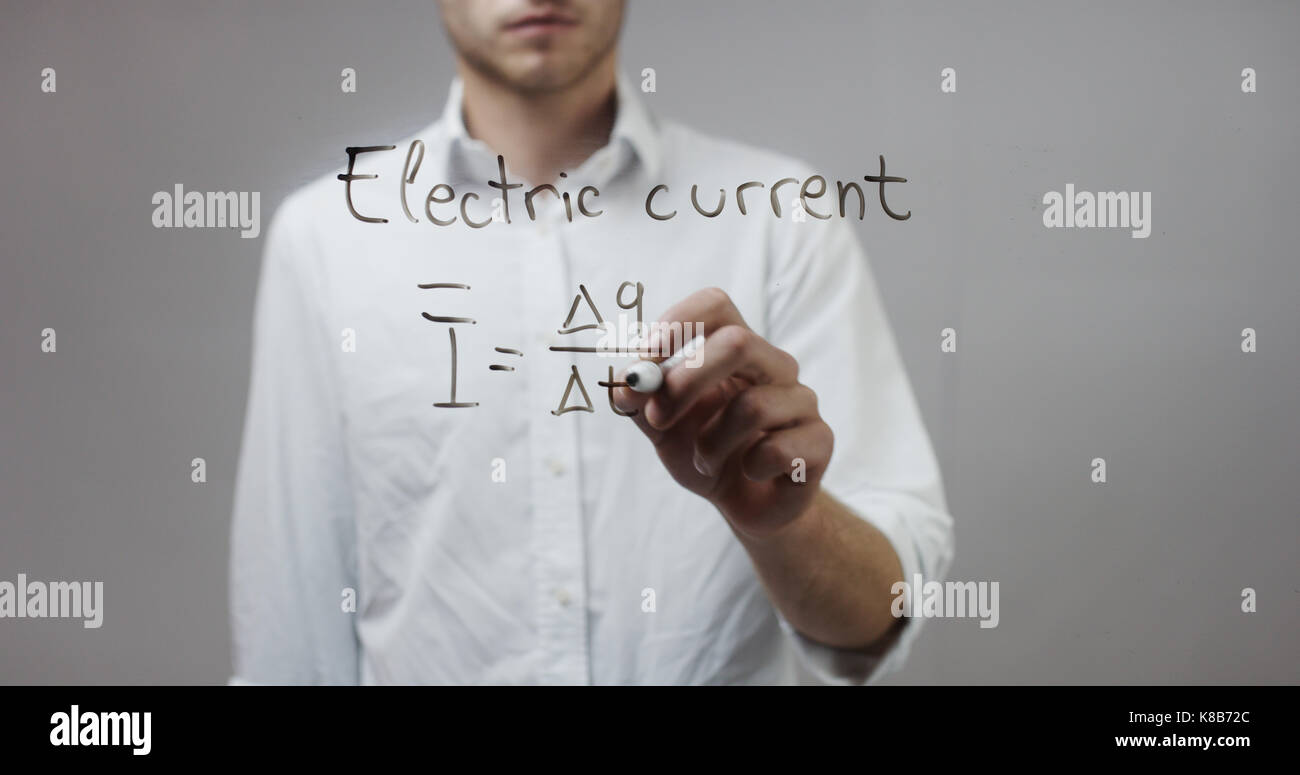 Electric current, Man Writing on Glass Stock Photo - Alamy