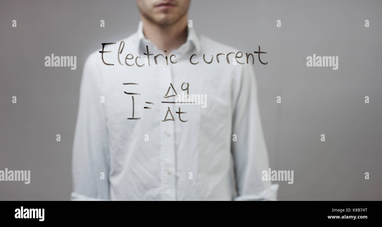 Electric current, Man Writing on Glass Stock Photo - Alamy