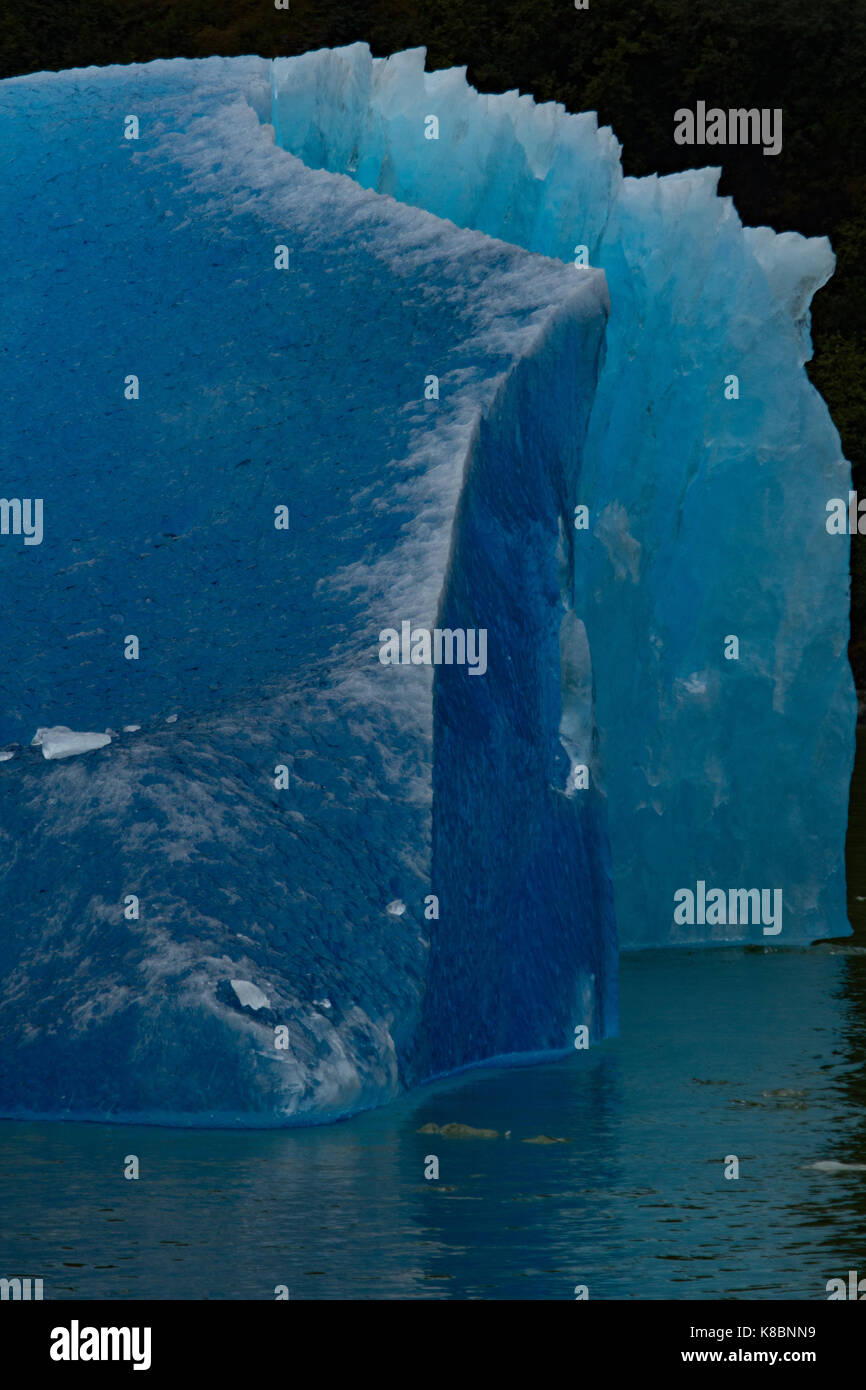 A giant blue iceberg in Tracy Arm wilderness area, Southeast Alaska USA ...